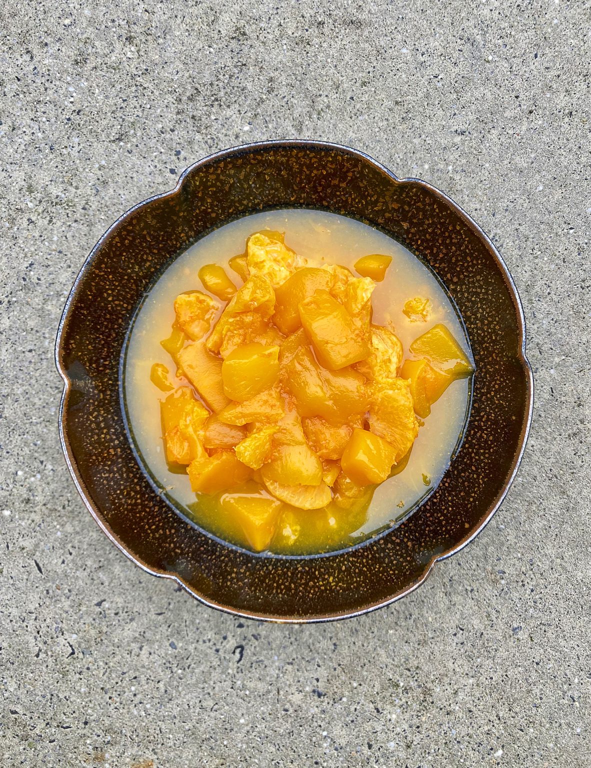 Mango compote with citrus fruits