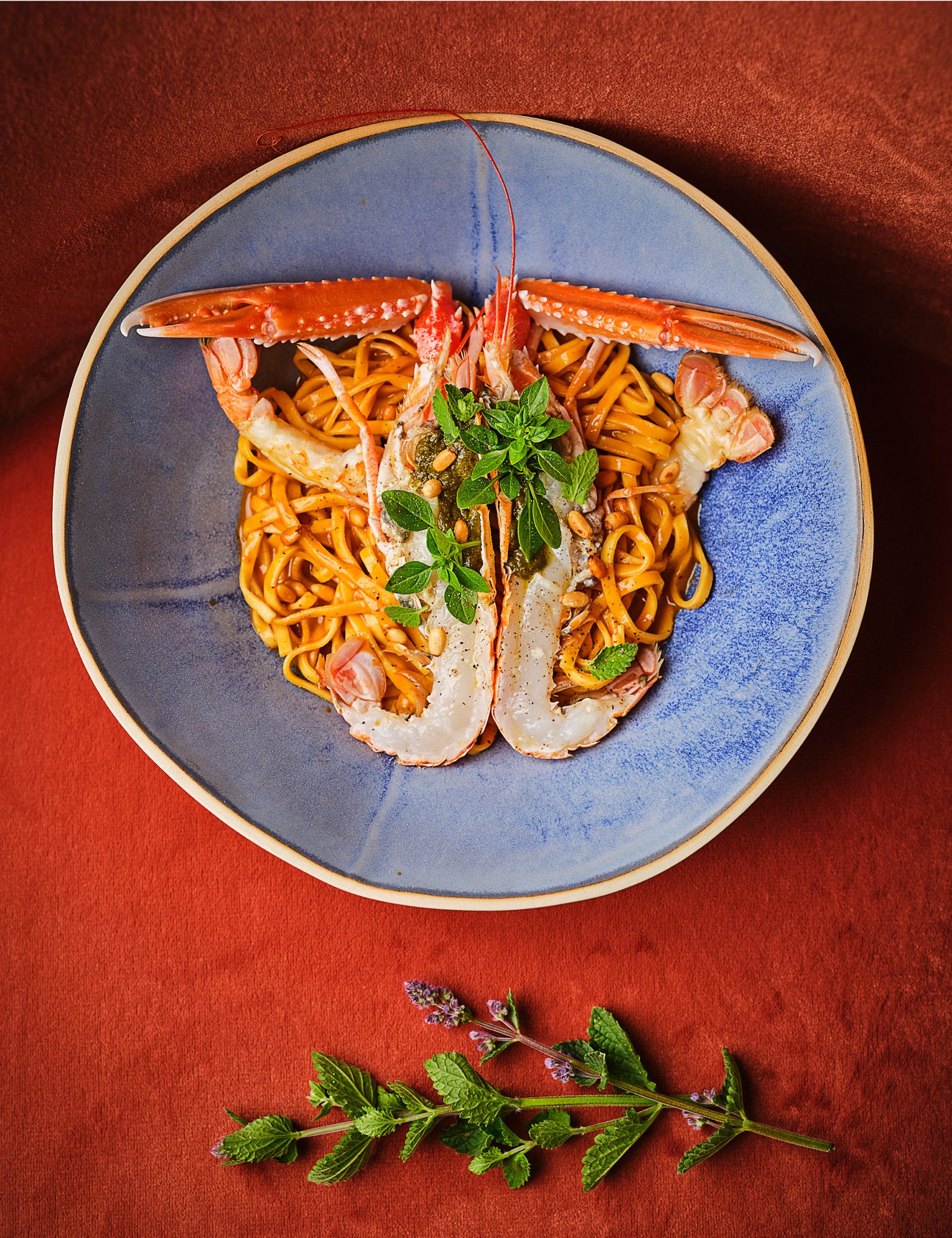 Taglioni with langoustines, bisque reduced with nepita